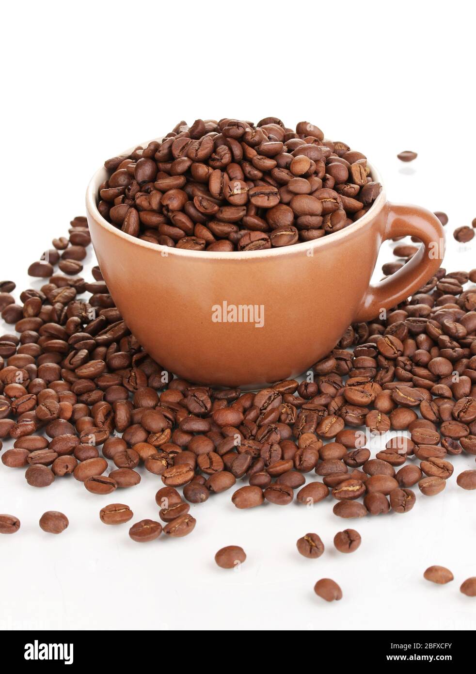 Coffee beans in cup isolated on white Stock Photo - Alamy