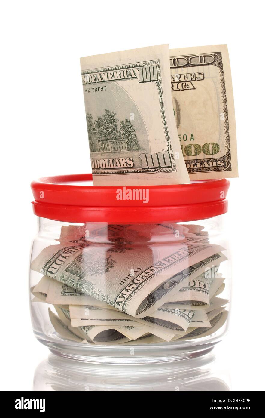 Clear glass jar for tips with money isolated on white Stock Photo - Alamy