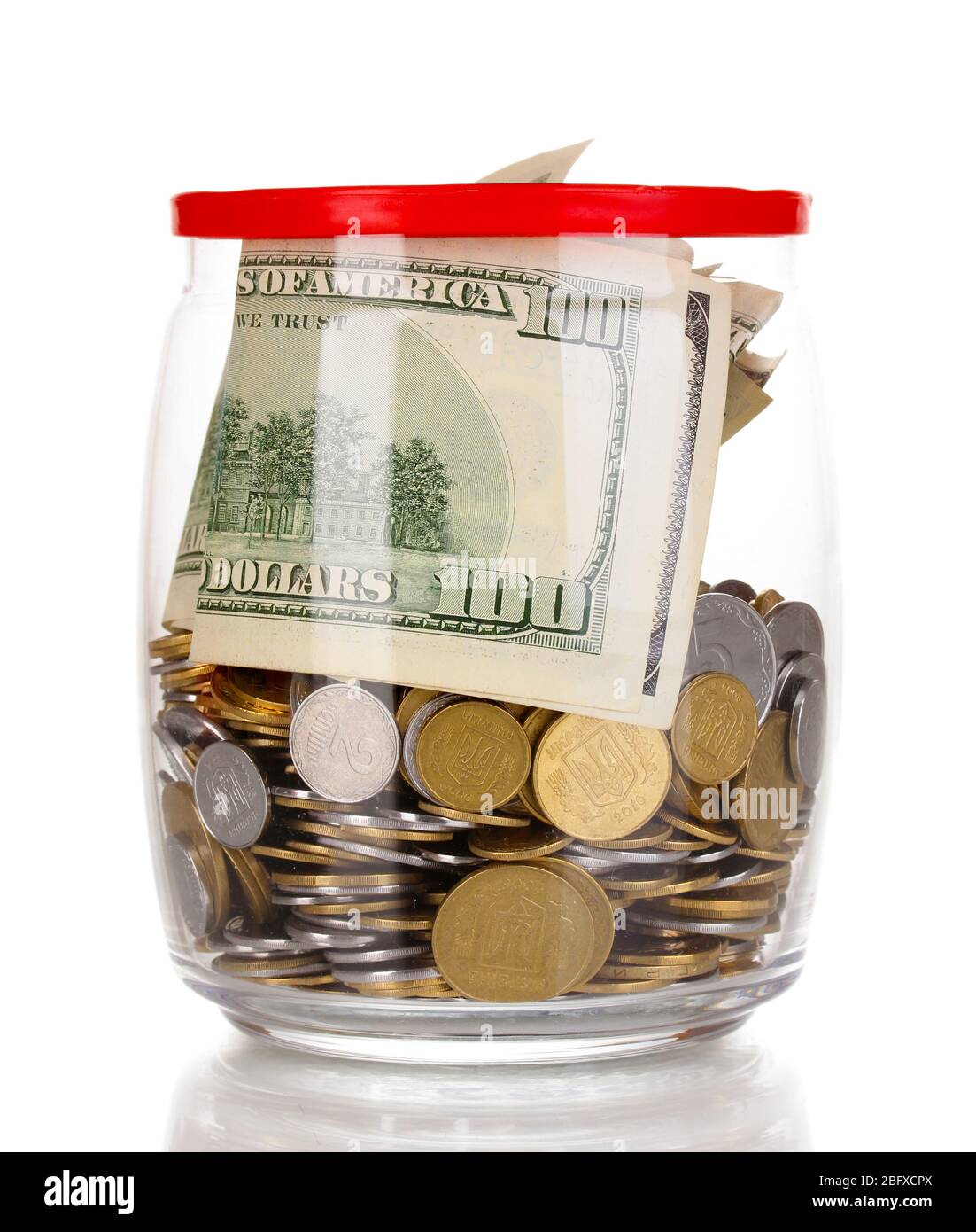 Clear glass jar for tips with money isolated on white Stock Photo - Alamy