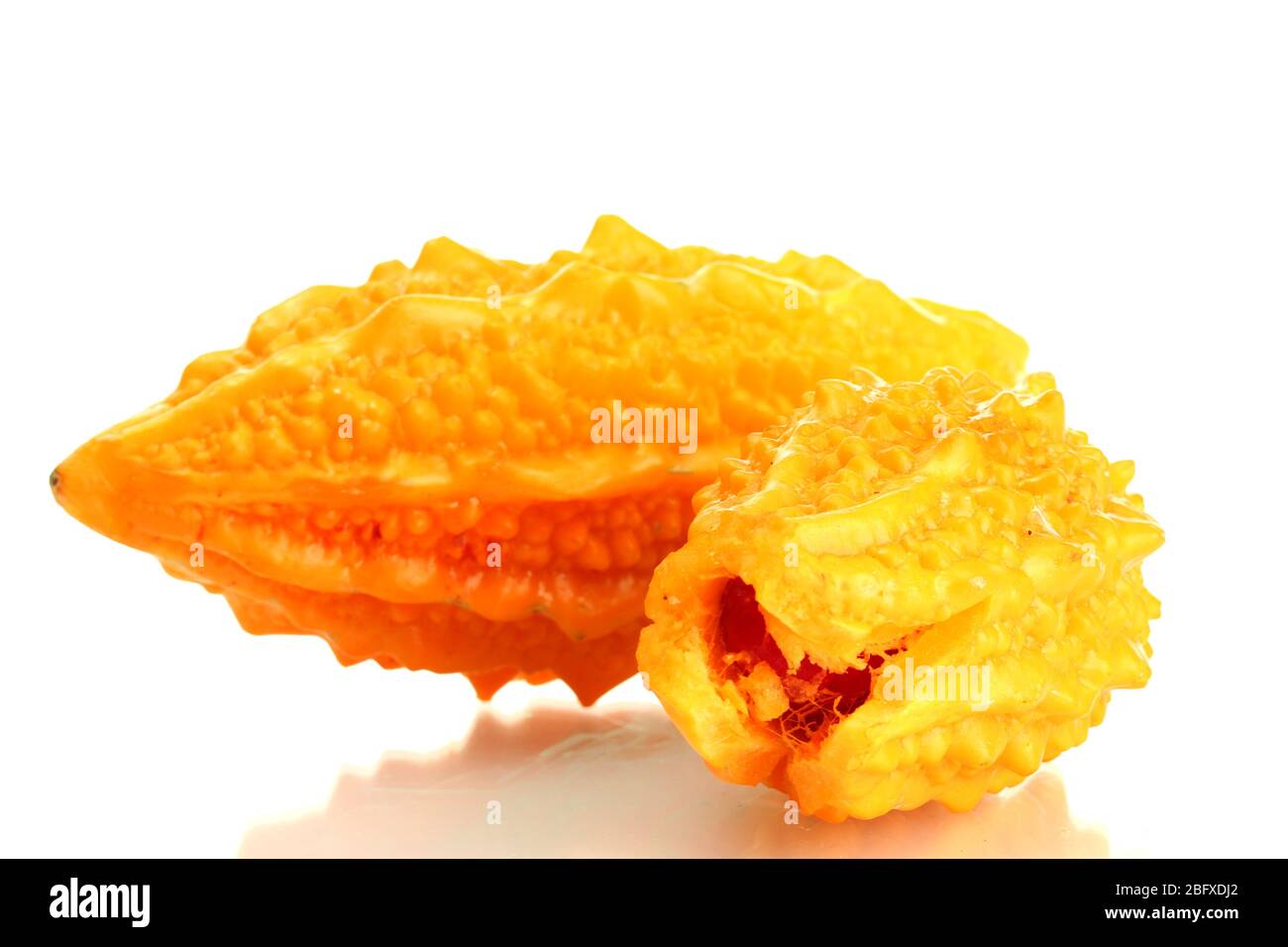 ripe momordica fruits, isolated on white Stock Photo - Alamy