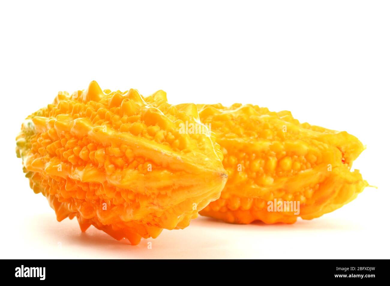 ripe momordica fruits, isolated on white Stock Photo - Alamy