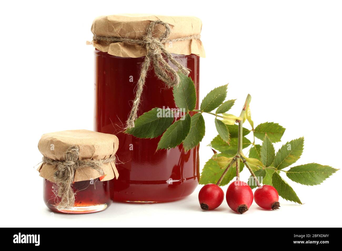 jars with hip roses jam and ripe berries, isolated on white Stock Photo ...