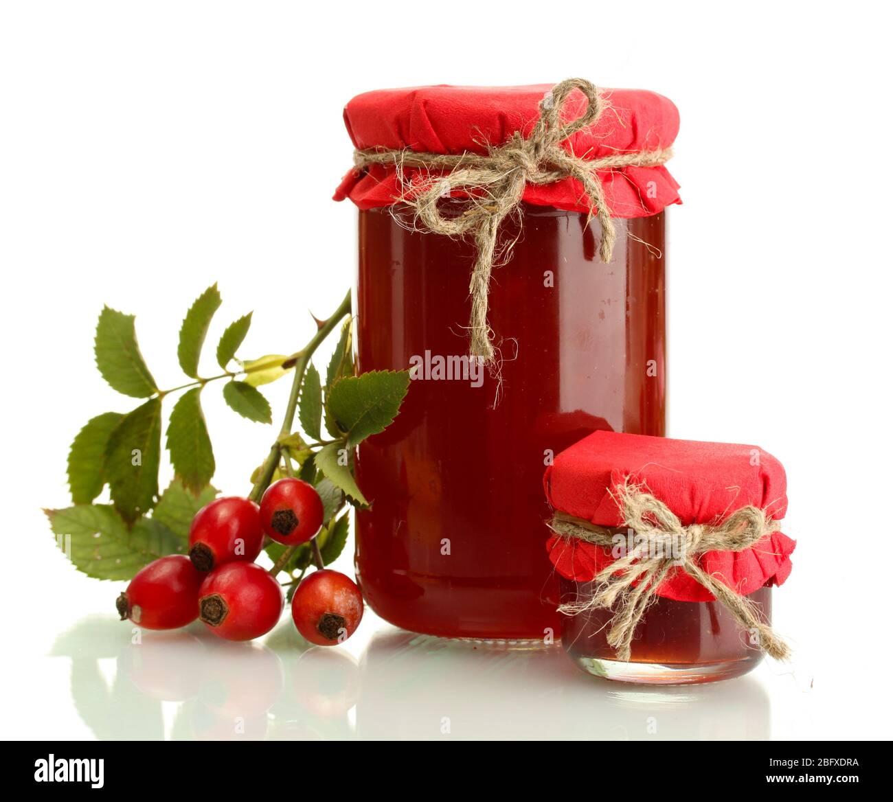 jars with hip roses jam and ripe berries, isolated on white Stock Photo ...