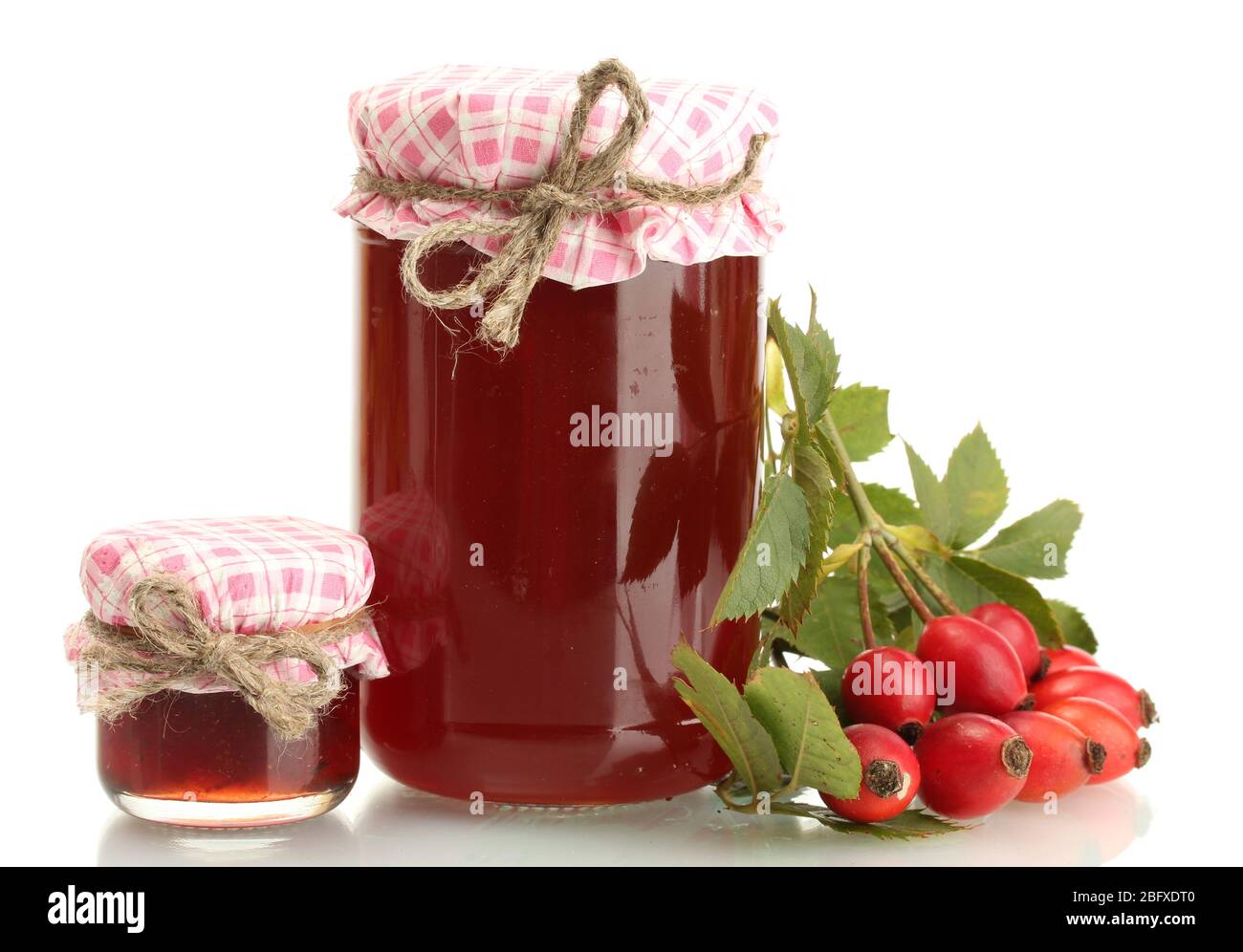 jars with hip roses jam and ripe berries, isolated on white Stock Photo ...