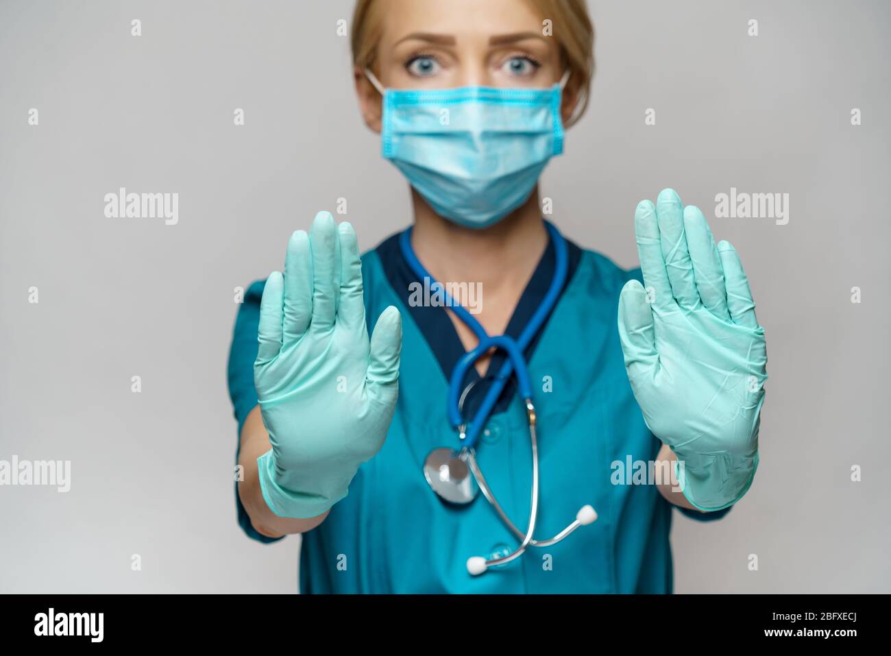 medical doctor nurse woman wearing protective mask and rubber or latex ...