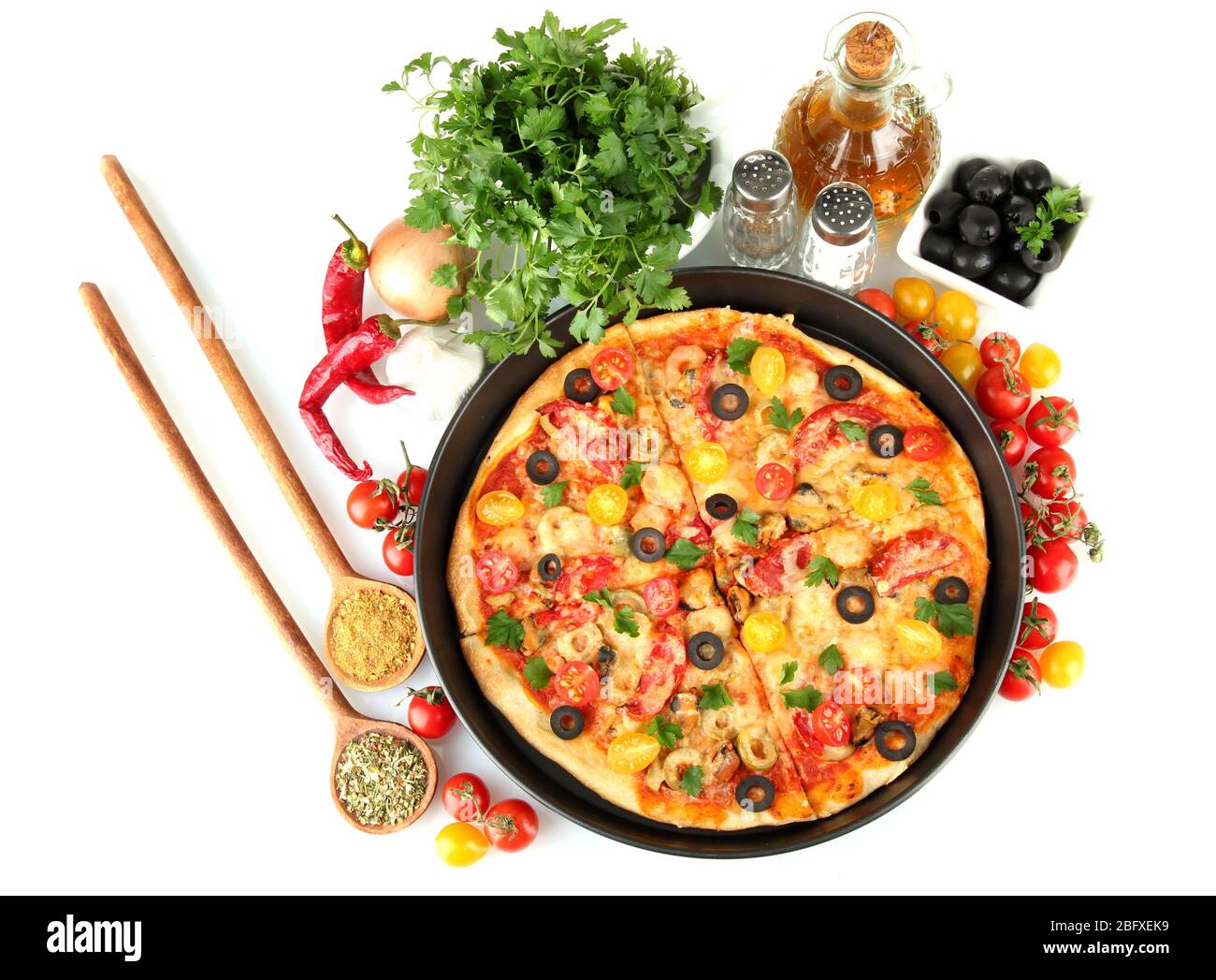 colorful composition of delicious pizza, vegetables and spices on white ...