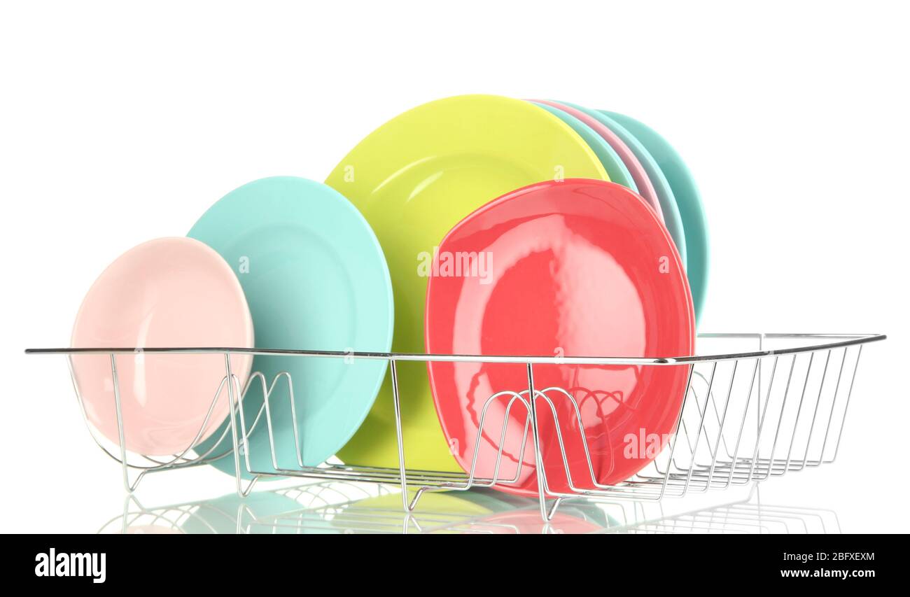 Color plates in rack isolated on white Stock Photo - Alamy