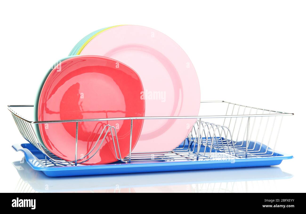 Color plates in rack isolated on white Stock Photo - Alamy