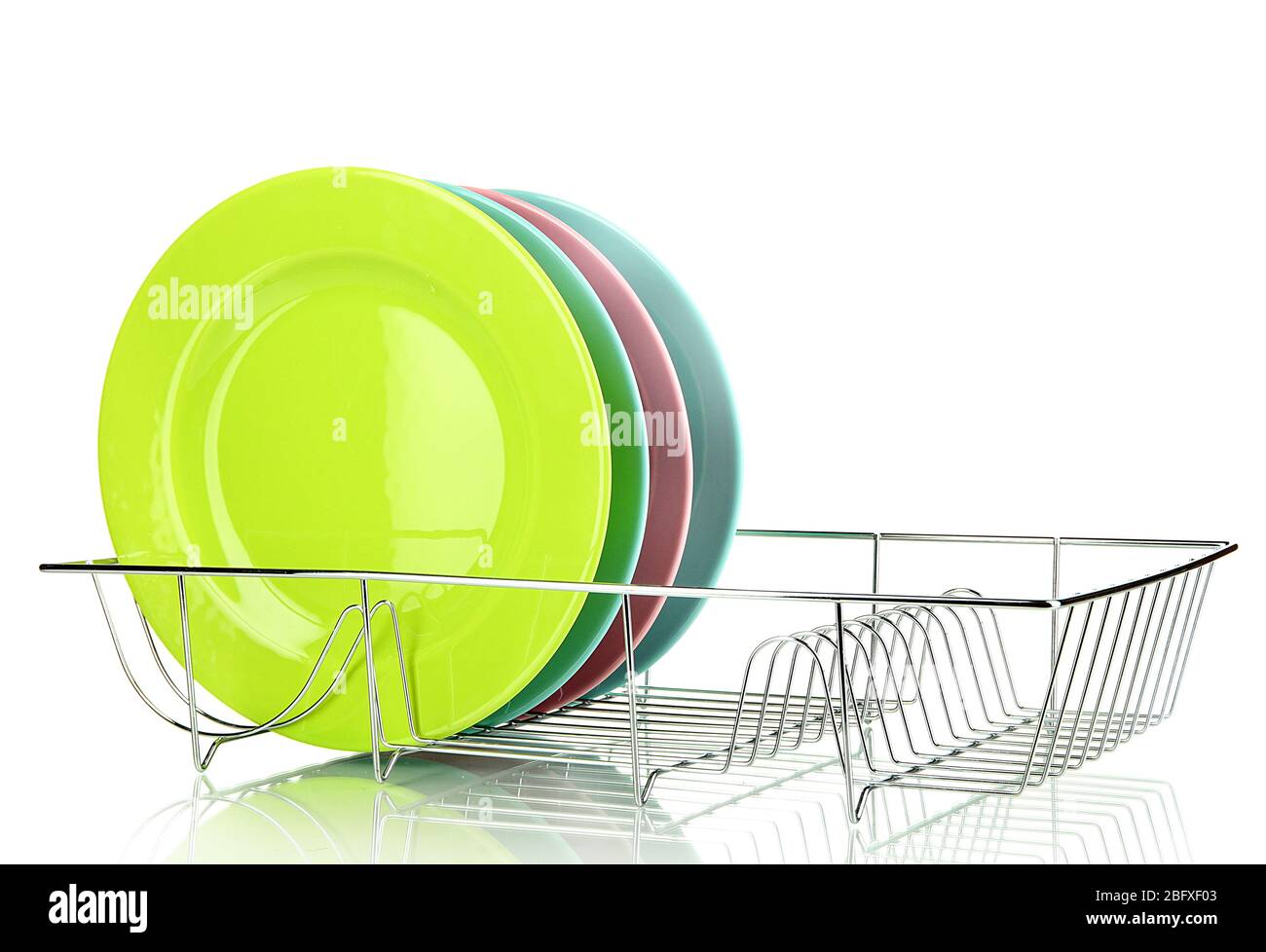 Color plates in rack isolated on white Stock Photo - Alamy