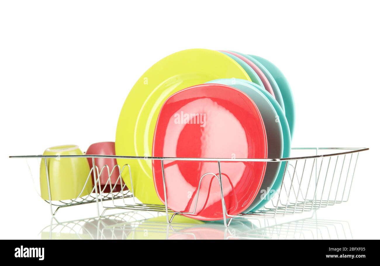 Color plates in rack isolated on white Stock Photo - Alamy