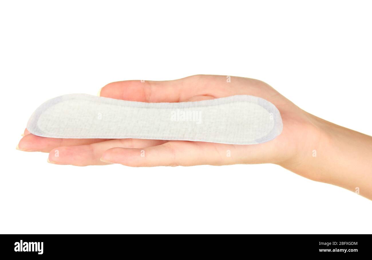 woman's hand holding a daily sanitary pad on white background close-up ...