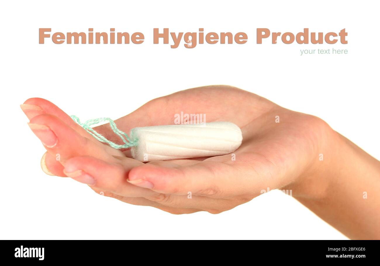 woman's hand holding a clean cotton tampon on white background close-up ...