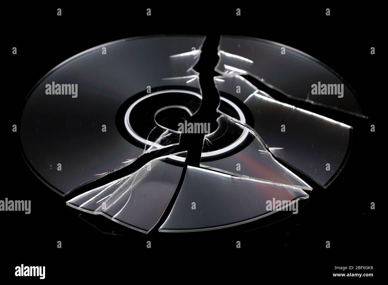 Broken disk with information isolated on black Stock Photo - Alamy