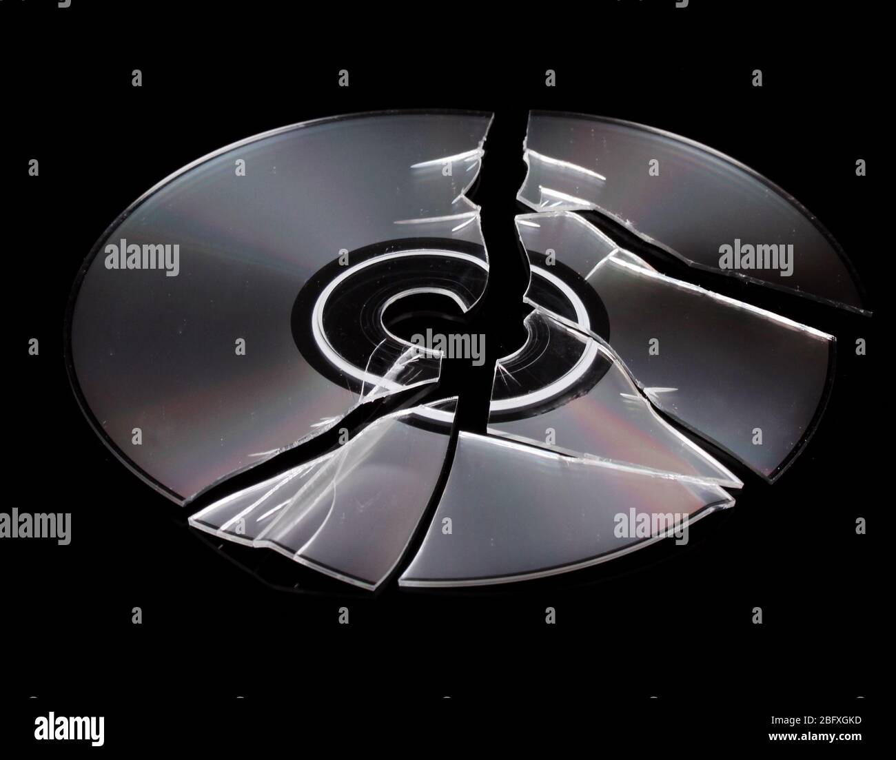 Broken disk with information isolated on black Stock Photo - Alamy