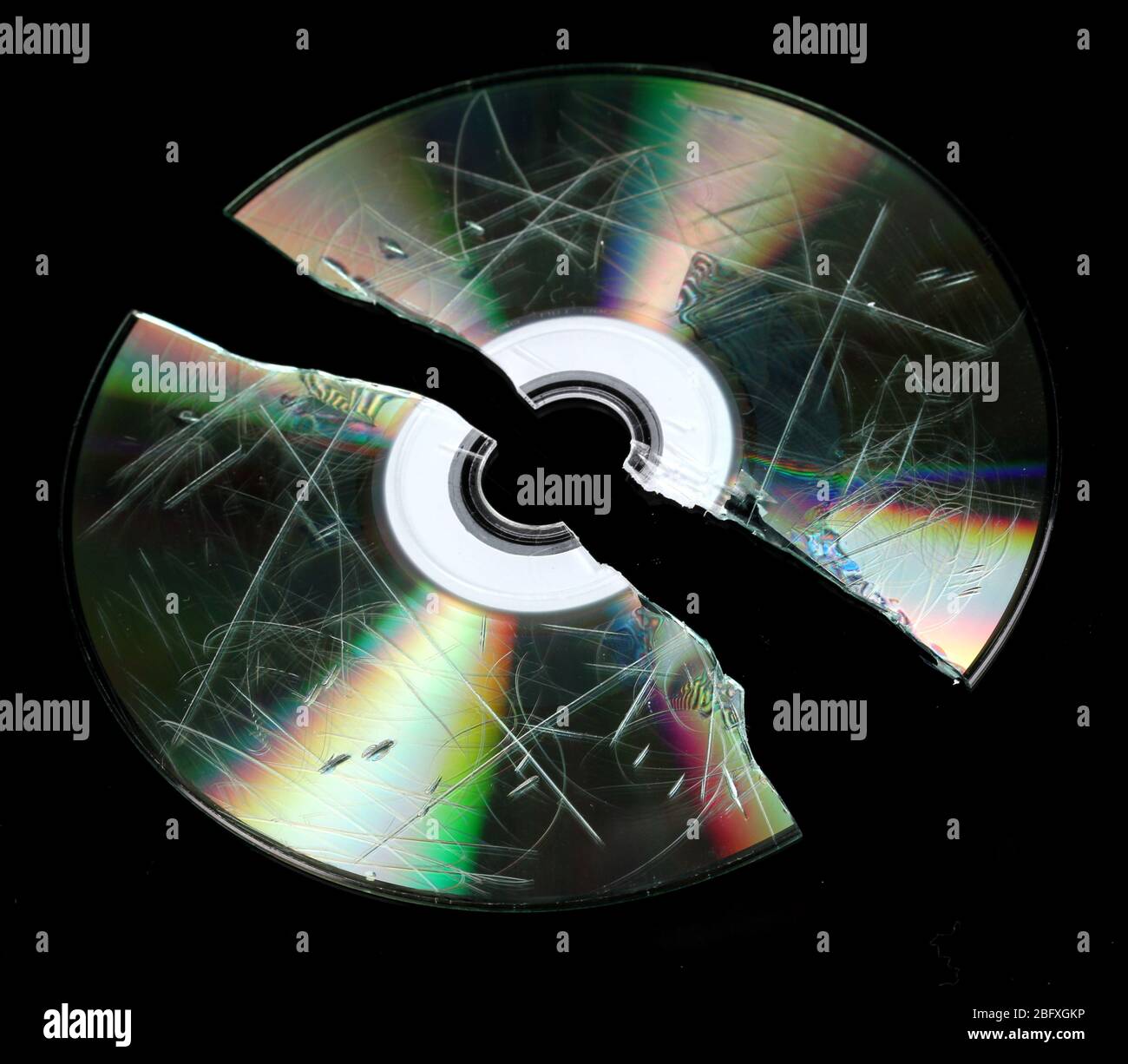 Defective and broken disk with information isolated on black Stock ...