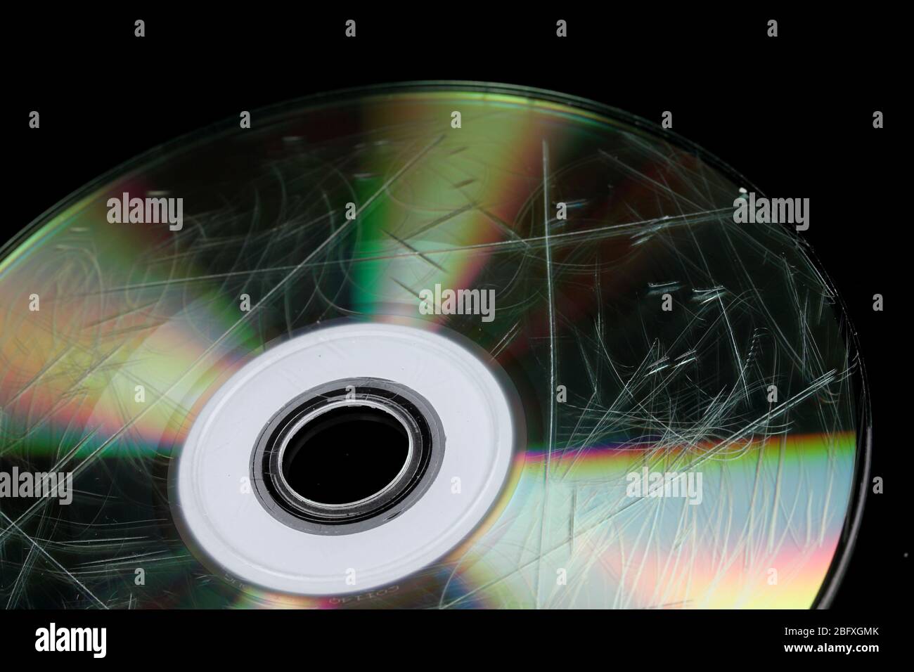 Defective disk with information isolated on black Stock Photo - Alamy