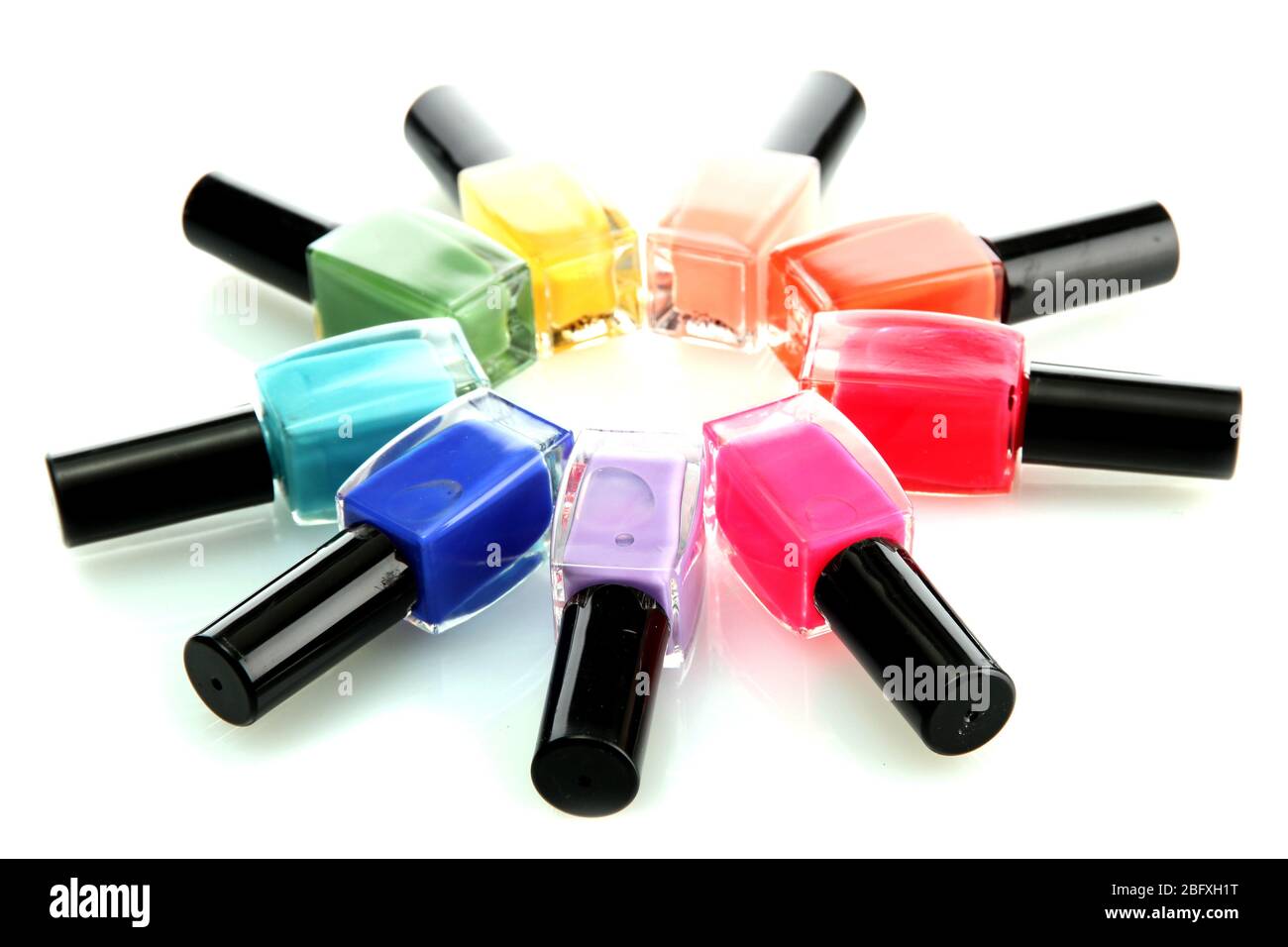 Group of bright nail polishes isolated on white Stock Photo - Alamy