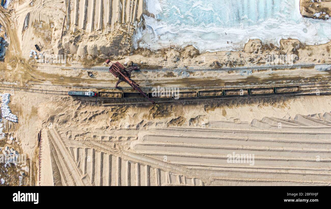 top view, loading sand into wagons Stock Photo - Alamy