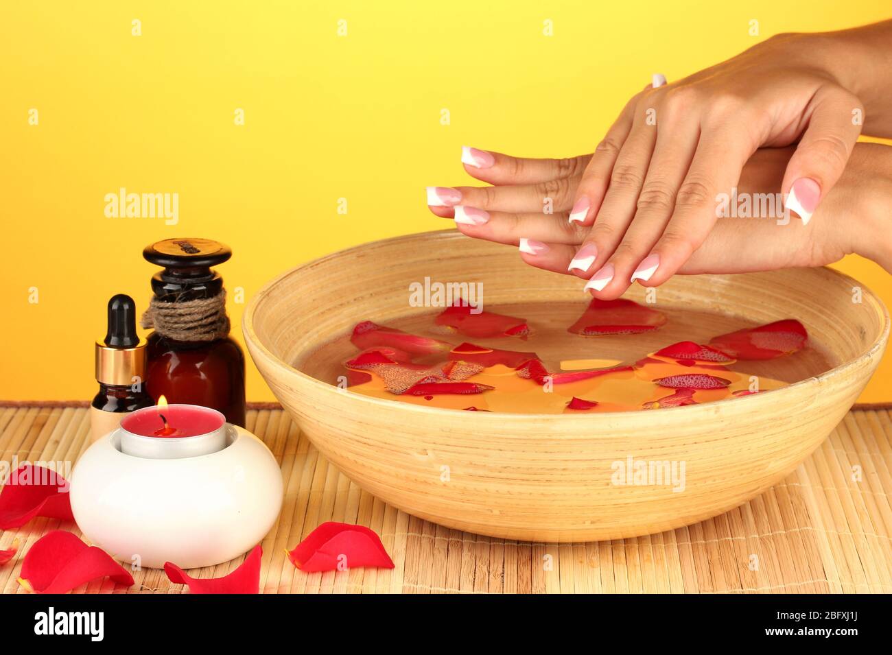 spa treatments for female hands, on yellow background Stock Photo - Alamy