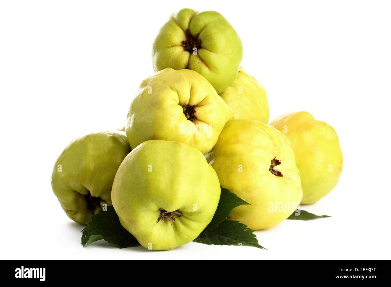 sweet quinces with leaves, isolated on white Stock Photo - Alamy
