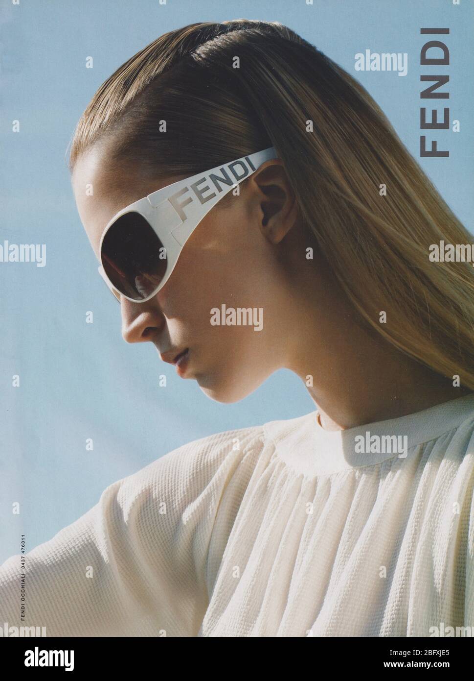 poster advertising FENDI fashion house with Raquel Zimmermann in paper ...