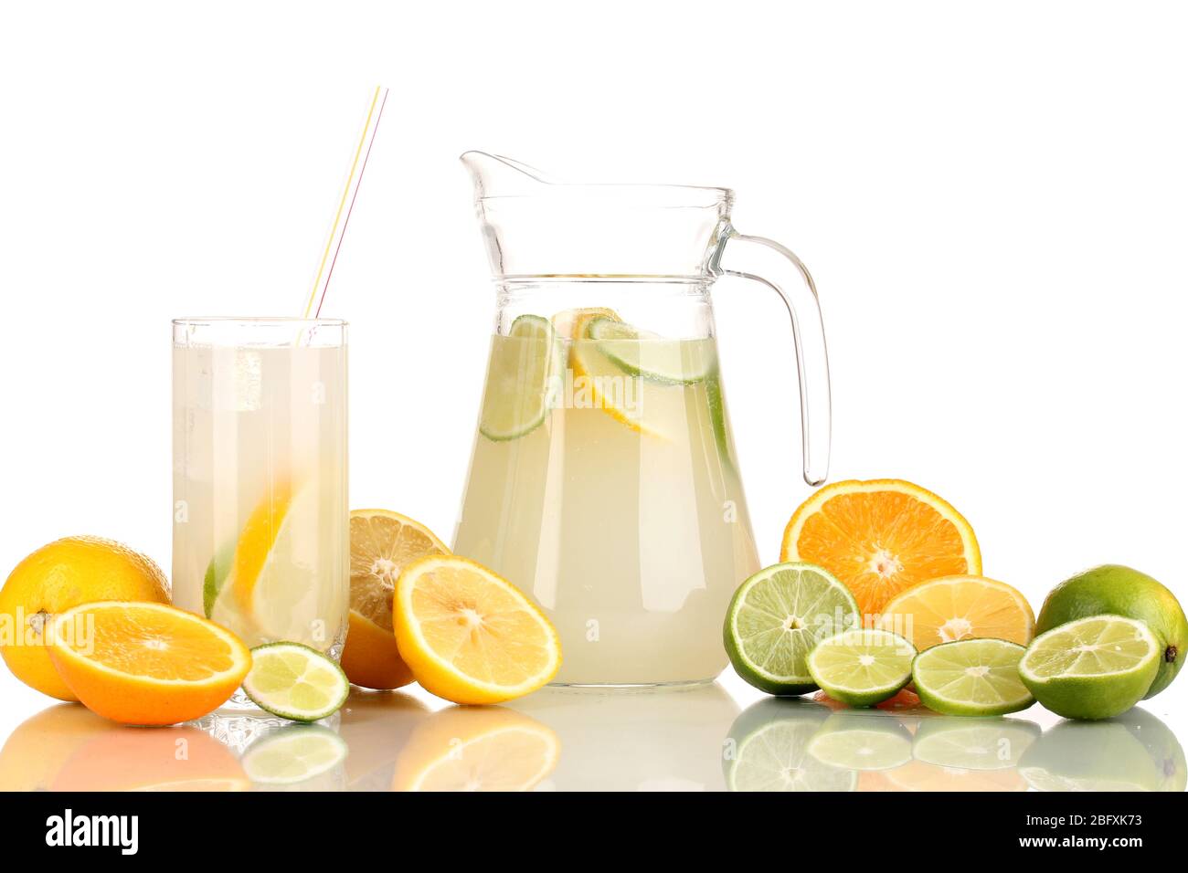 Citrus lemonade in pitcher and glass of citrus around isolated on white ...