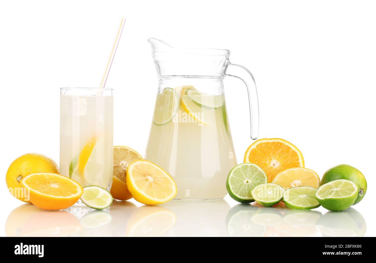 Citrus lemonade in pitcher and glass of citrus around isolated on white ...
