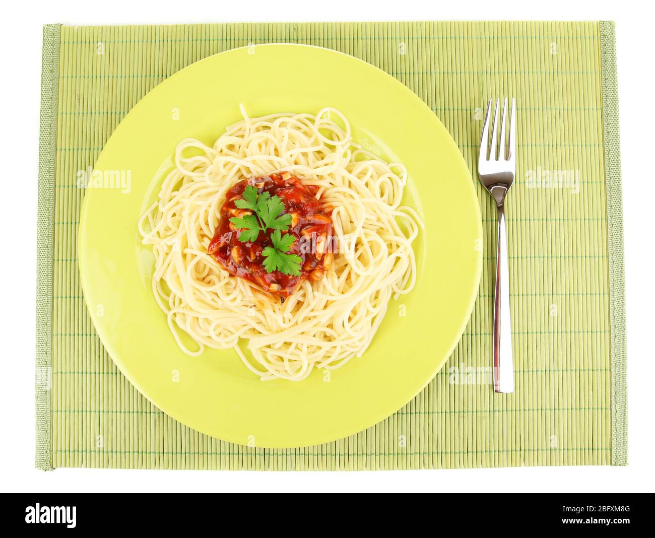 Italian spaghetti in plate on bamboo mat Stock Photo - Alamy
