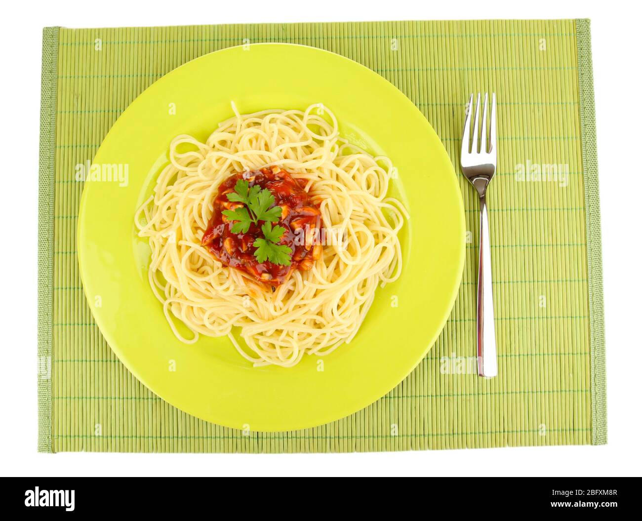 Italian spaghetti in plate on bamboo mat Stock Photo - Alamy