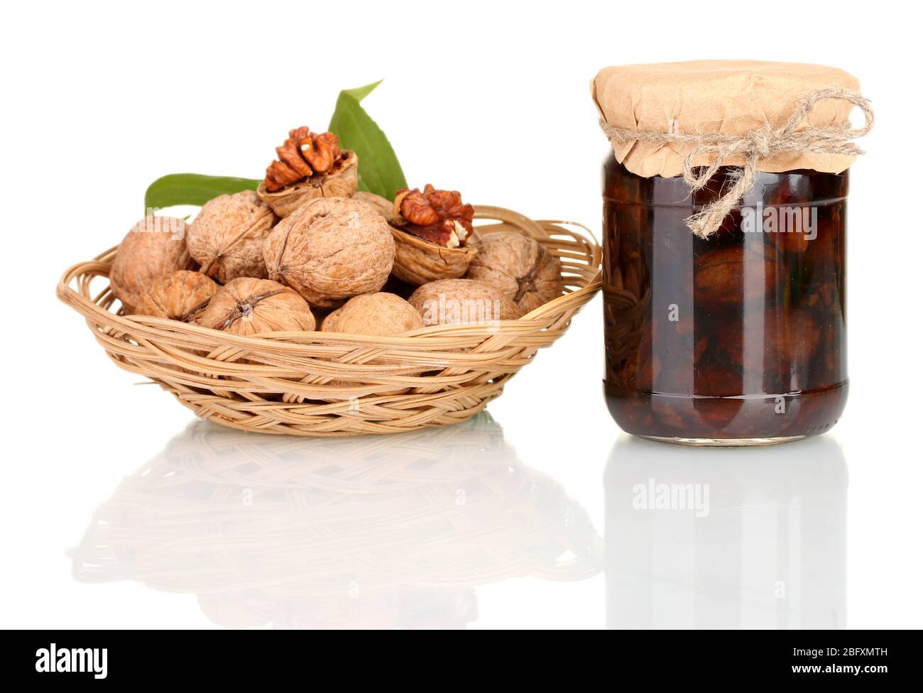 jam-jar of walnuts and a basket with walnuts Stock Photo - Alamy