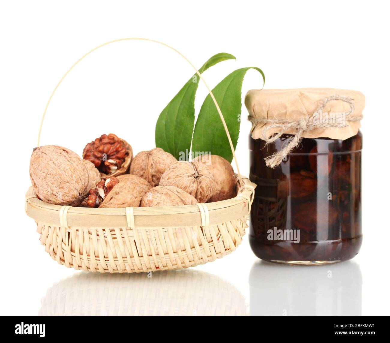 jam-jar of walnuts and a basket with walnuts Stock Photo - Alamy