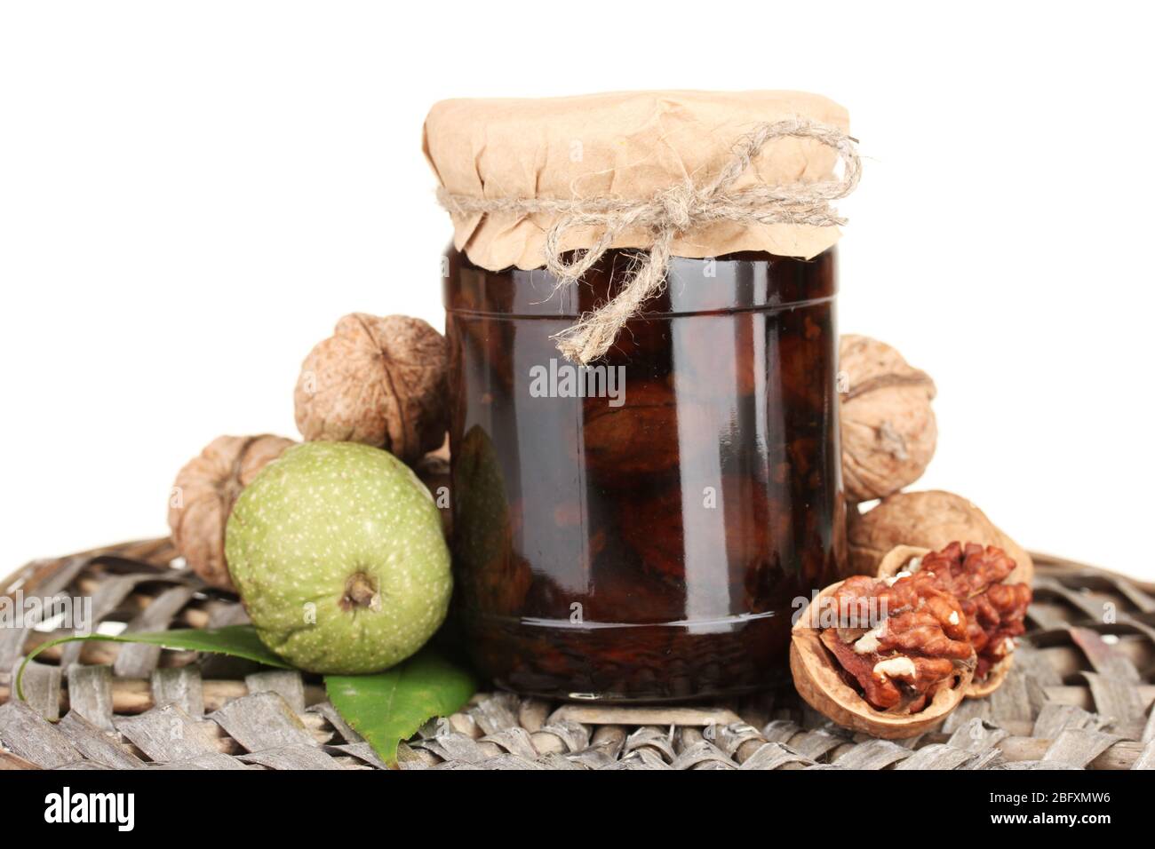 jam-jar of walnuts on wicker mat Stock Photo - Alamy