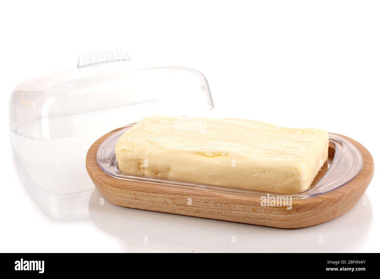 Butter on wooden holder isolated on white Stock Photo - Alamy