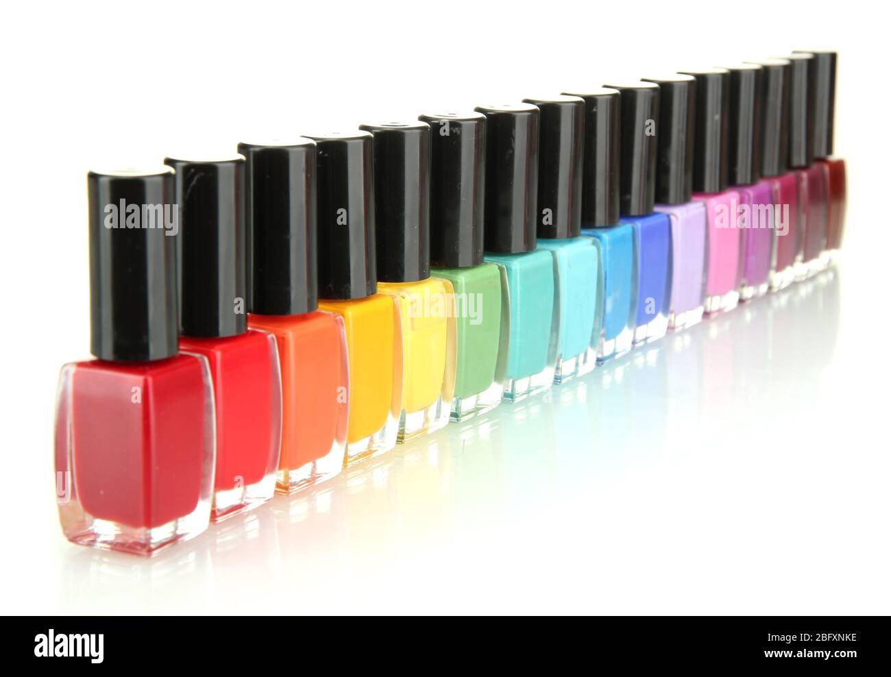 Group of bright nail polishes isolated on white Stock Photo - Alamy