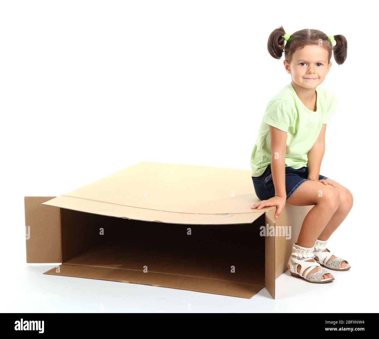 beautiful little girl with box isolated on white Stock Photo - Alamy