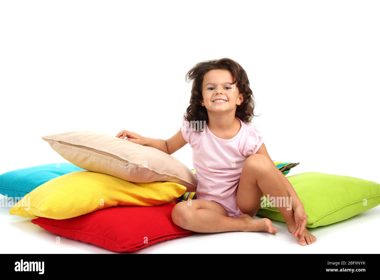 beautiful little girlwith pillows isolated on white Stock Photo - Alamy