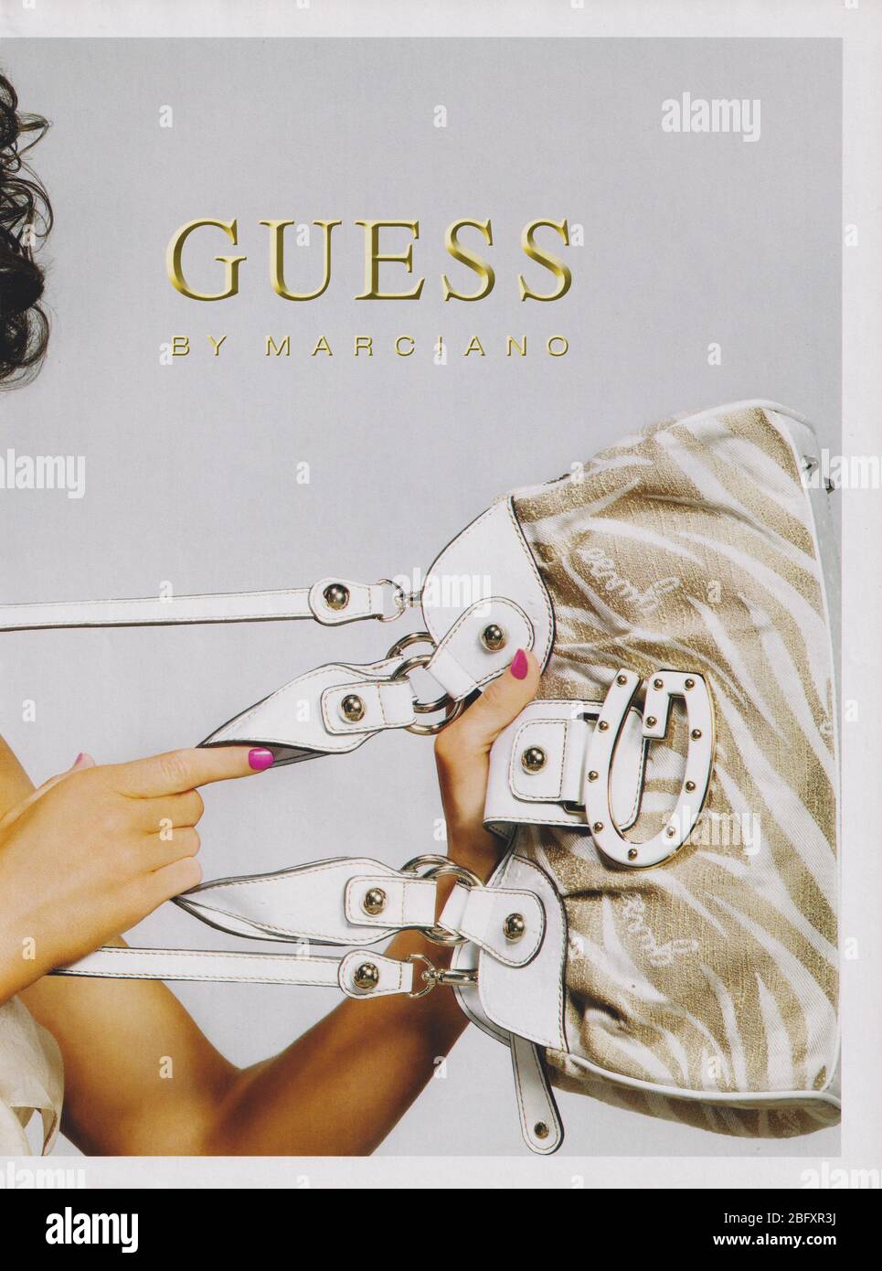 poster advertising GUESS with Line Gost female model in paper magazine ...
