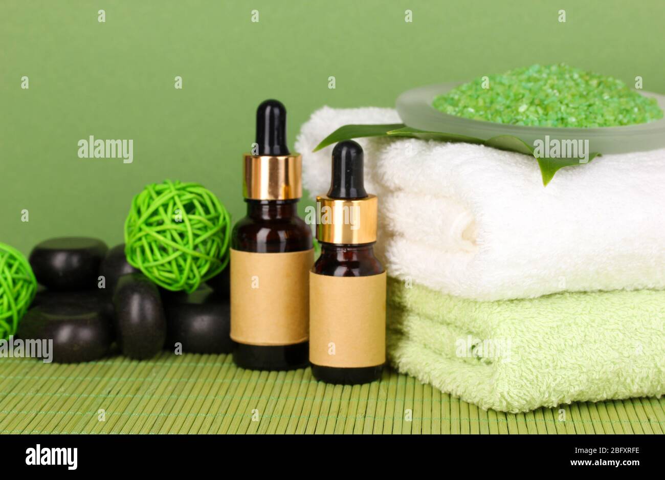beautiful spa setting on green background Stock Photo - Alamy