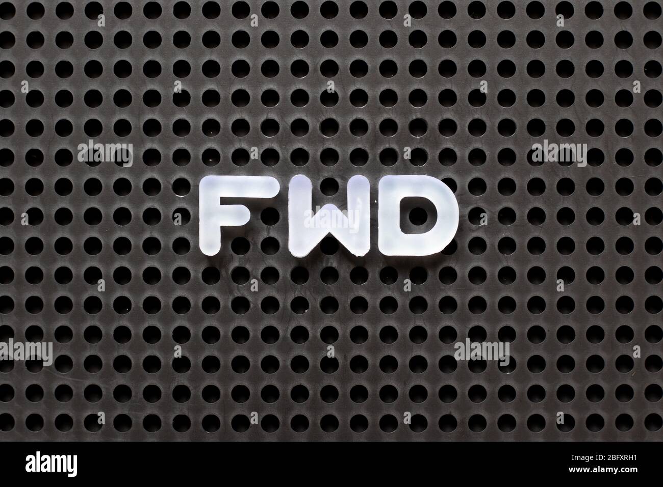 Black color pegboard with white letter in word FWD (Abbreviation of ...
