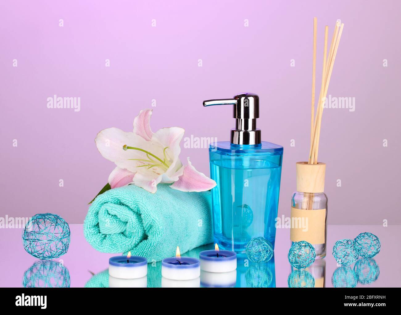 Beautiful spa setting on purple background with reflection Stock Photo ...