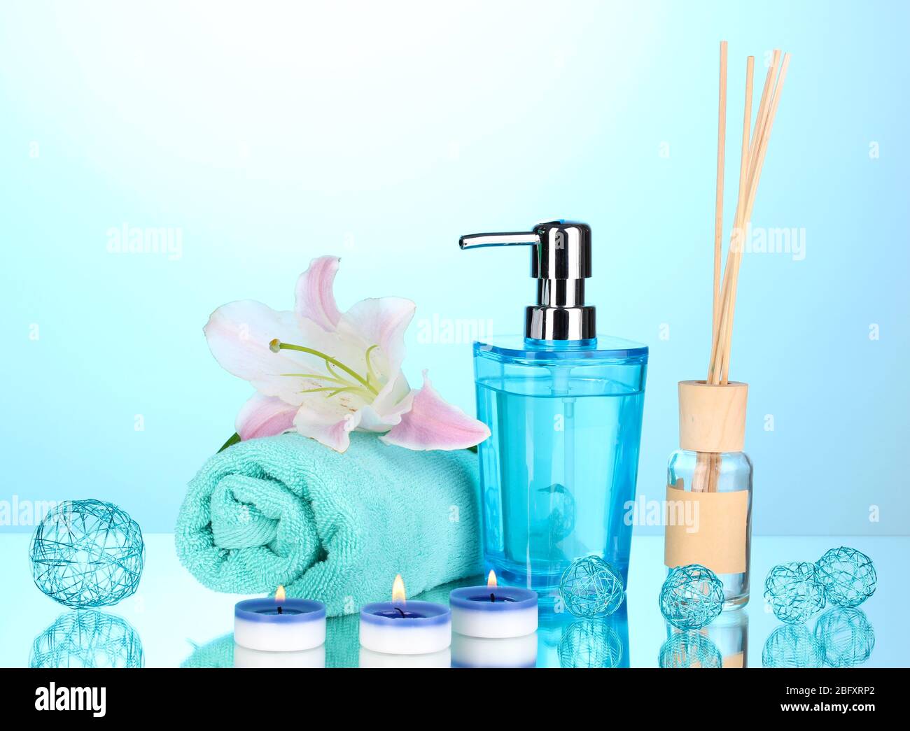 Beautiful spa setting on blue background with reflection Stock Photo ...