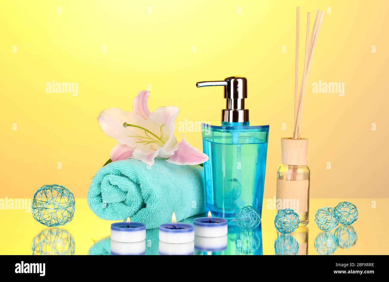 Beautiful spa setting on yellow background with reflection Stock Photo ...