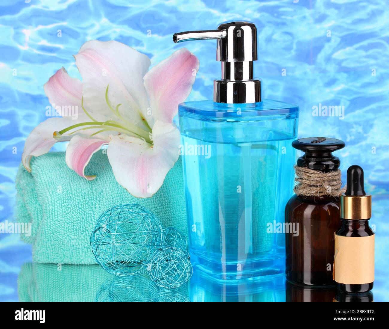 Beautiful spa setting on water background with reflection Stock Photo ...