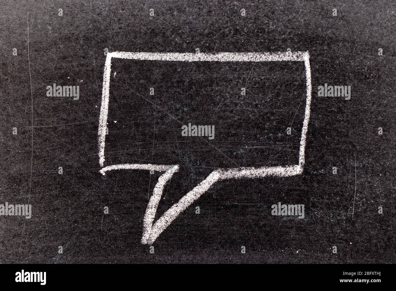 White chalk hand drawing in bubble speech shape with blank space for ...