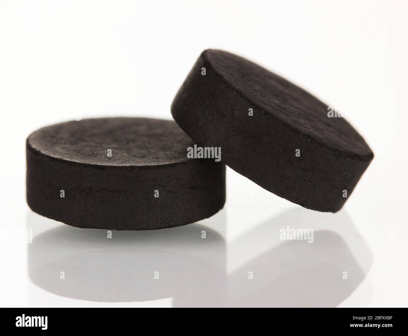 activated carbon in tablets isolated on white Stock Photo - Alamy