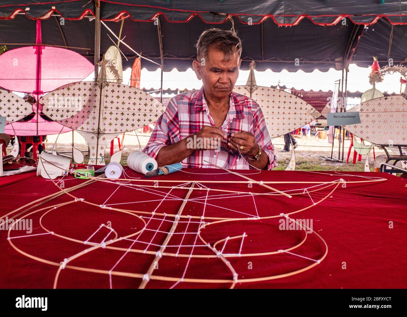 Man making traditional kites from Southern Thailand during Satun ...