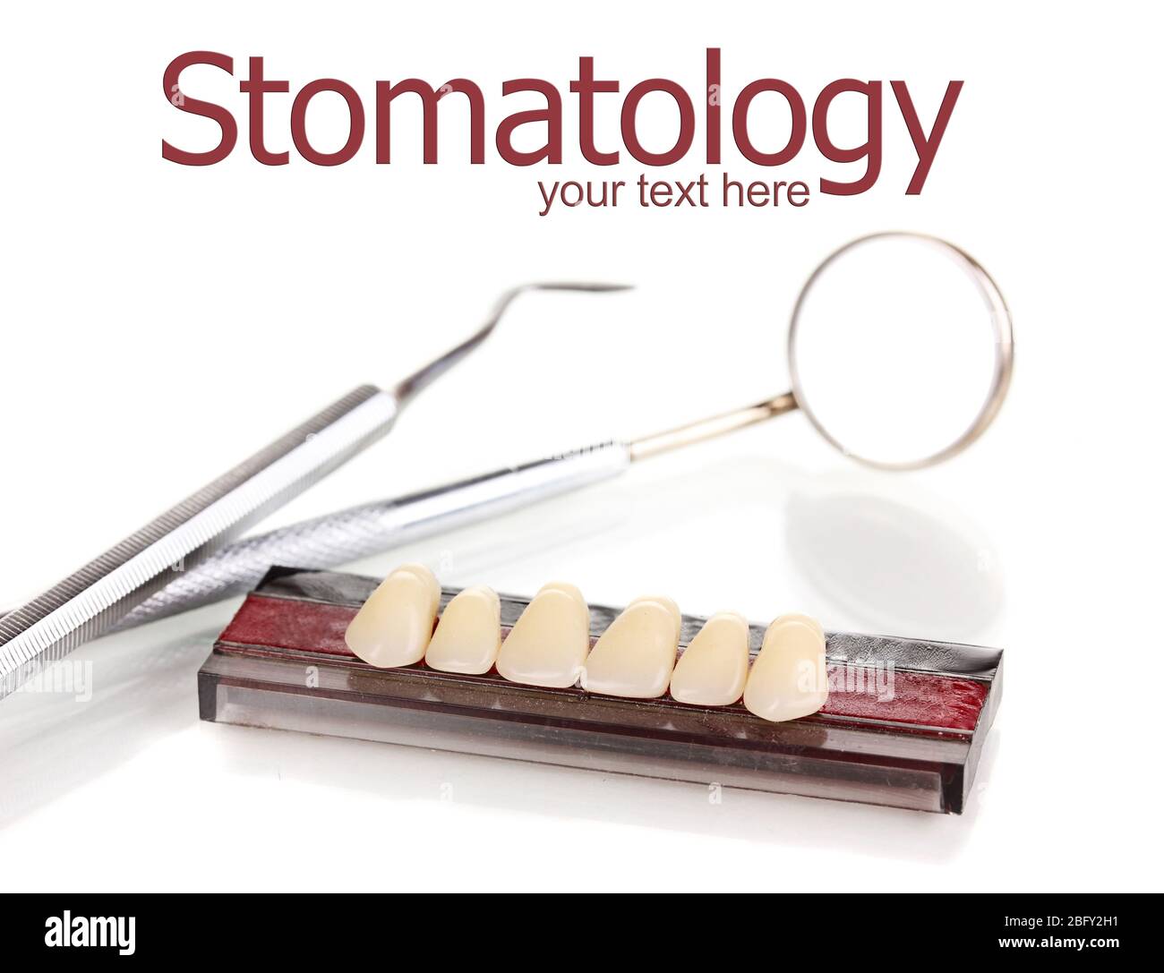 Denture with dental tools isolated on white Stock Photo - Alamy