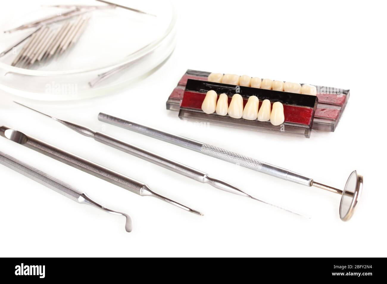 denture with dental tools isolated on white Stock Photo - Alamy
