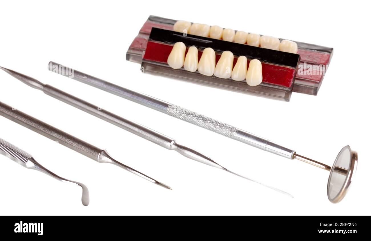 denture with dental tools isolated on white Stock Photo - Alamy