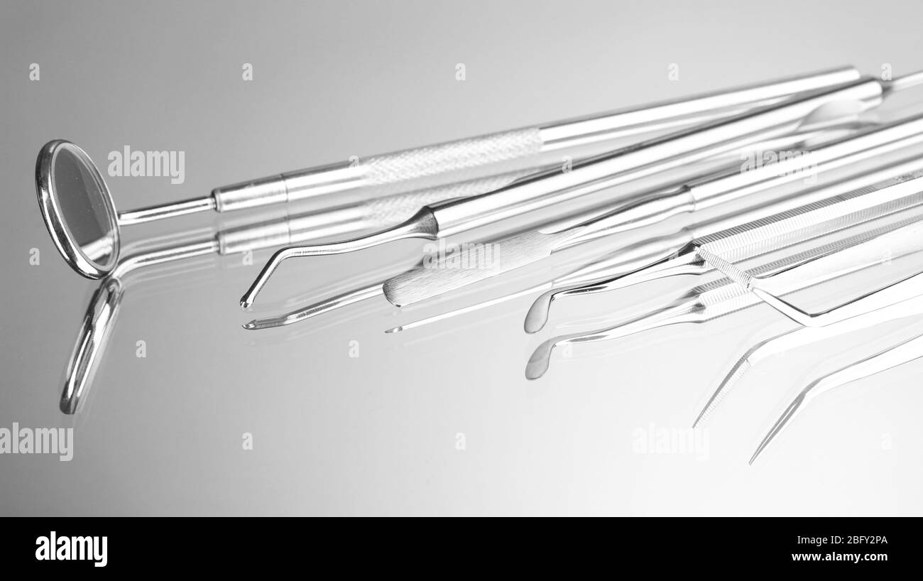Set of dental tools for teeth care isolated on grey background Stock ...
